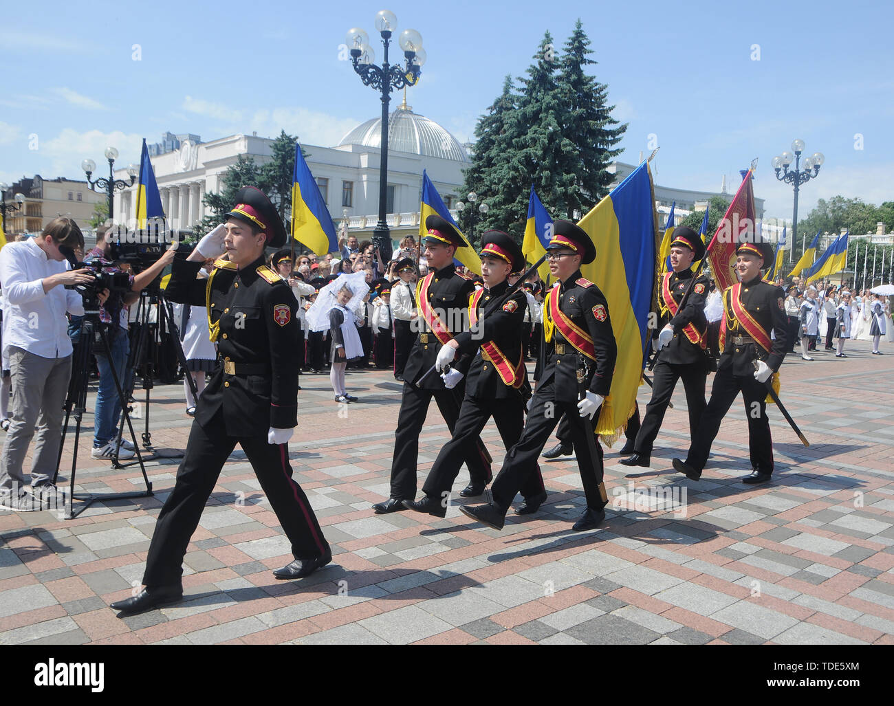 The cadets march with Ukrainian flags during the ceremony. Holiday ...