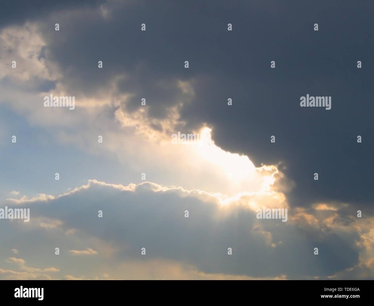 rain cloud and rays of sunlight Stock Photo - Alamy