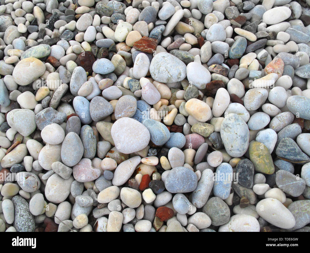 Background with colorful sea pebbles Stock Photo - Alamy