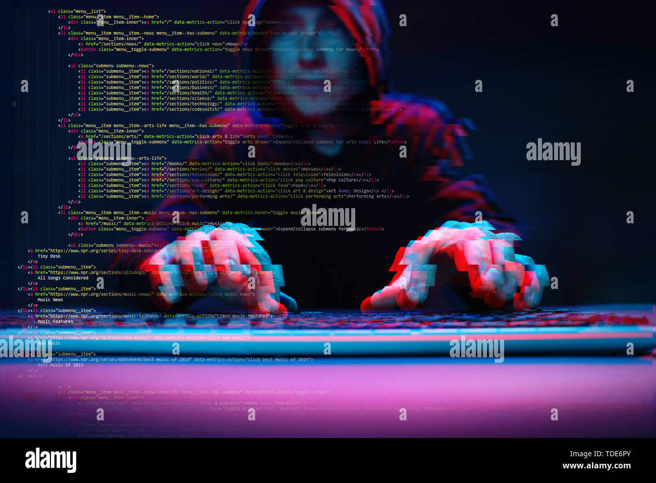 Hacker working with computer in dark room with digital interface around ...