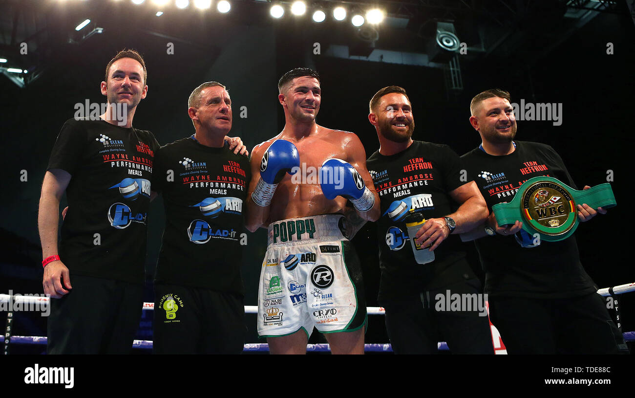 Mark Heffron (centre) poses with his team after his win against Daniel ...