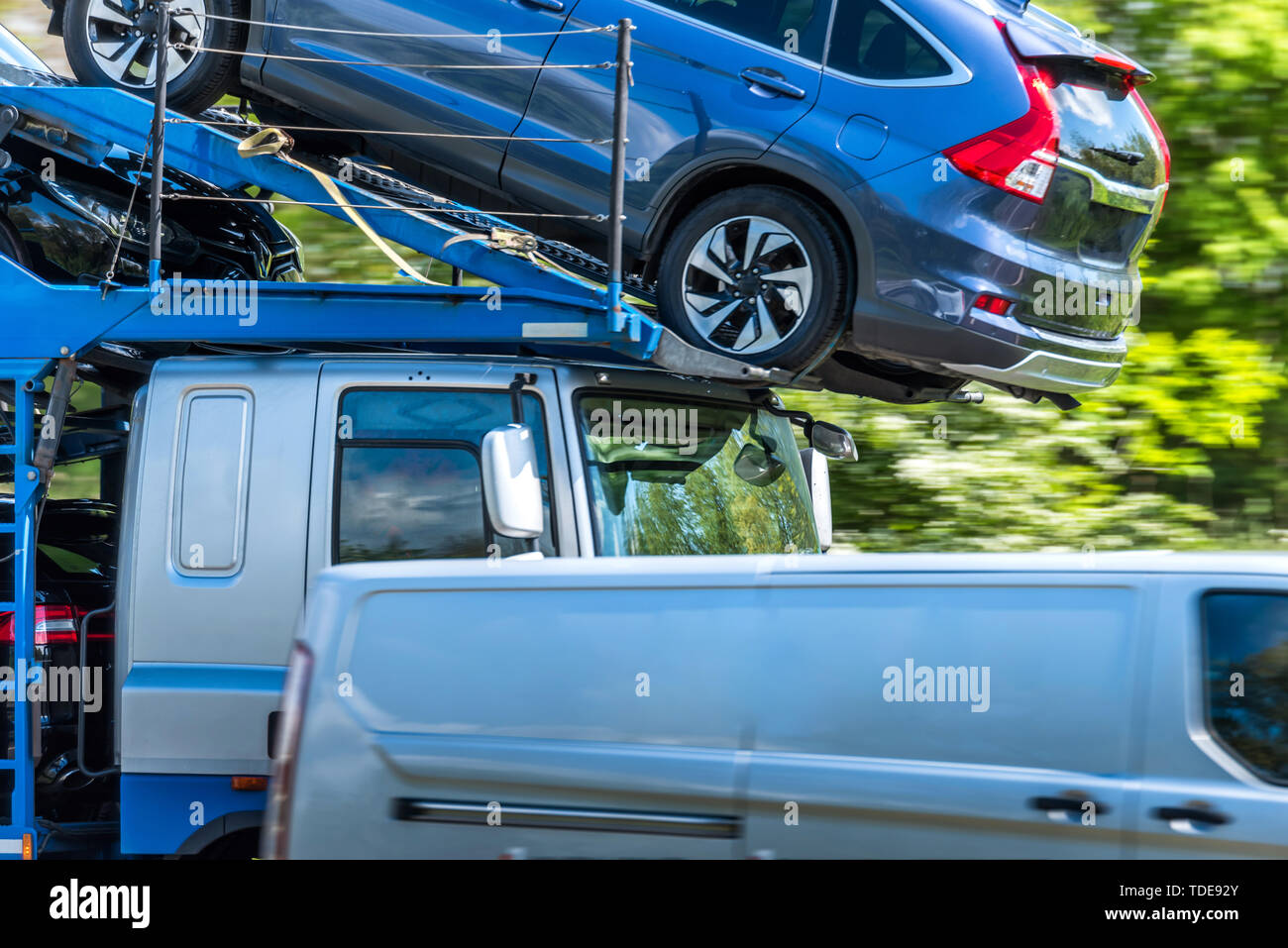 transporter truck loaded with cars on uk motorway in fast motion Stock ...