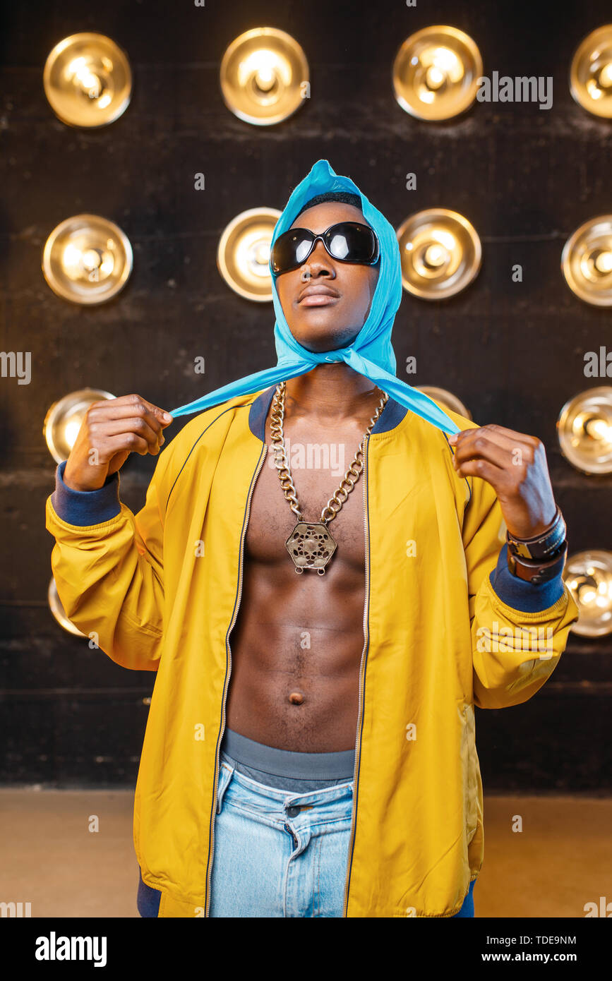 Black rapper, perfomance on stage with spotlights Stock Photo - Alamy