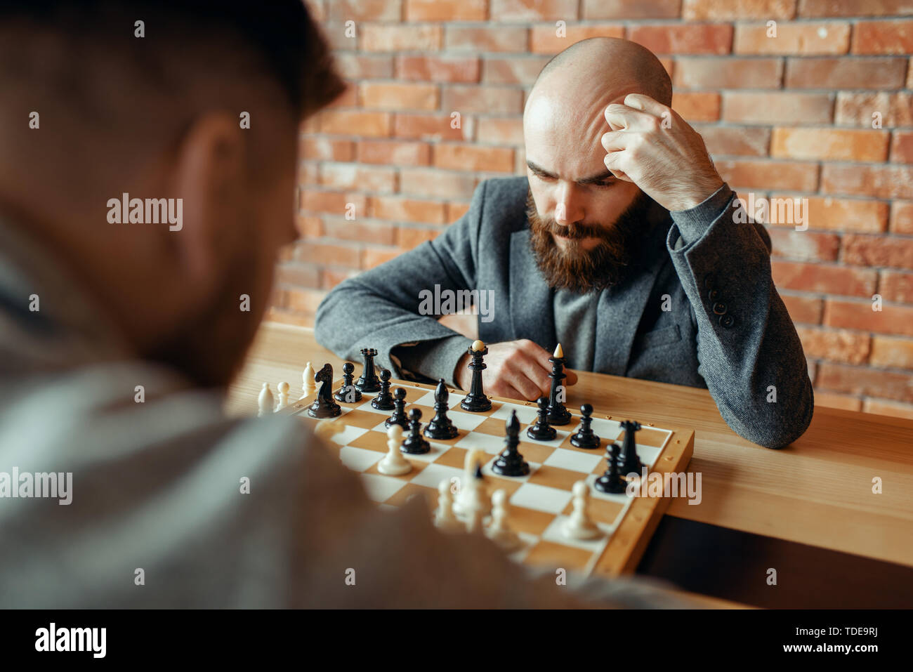 Male chess players playing, thinking process Stock Photo - Alamy