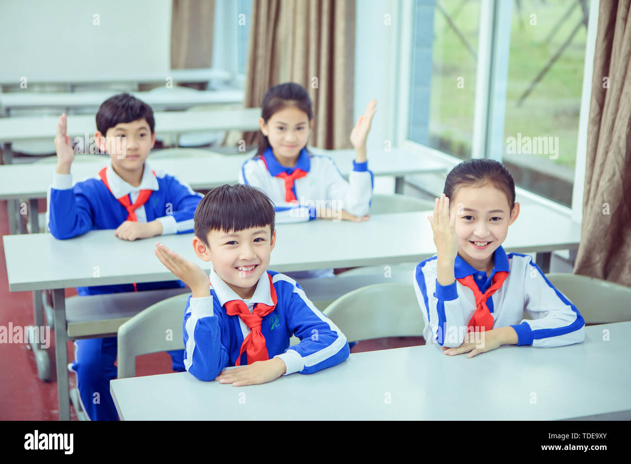 Hand raised class china hi-res stock photography and images - Alamy