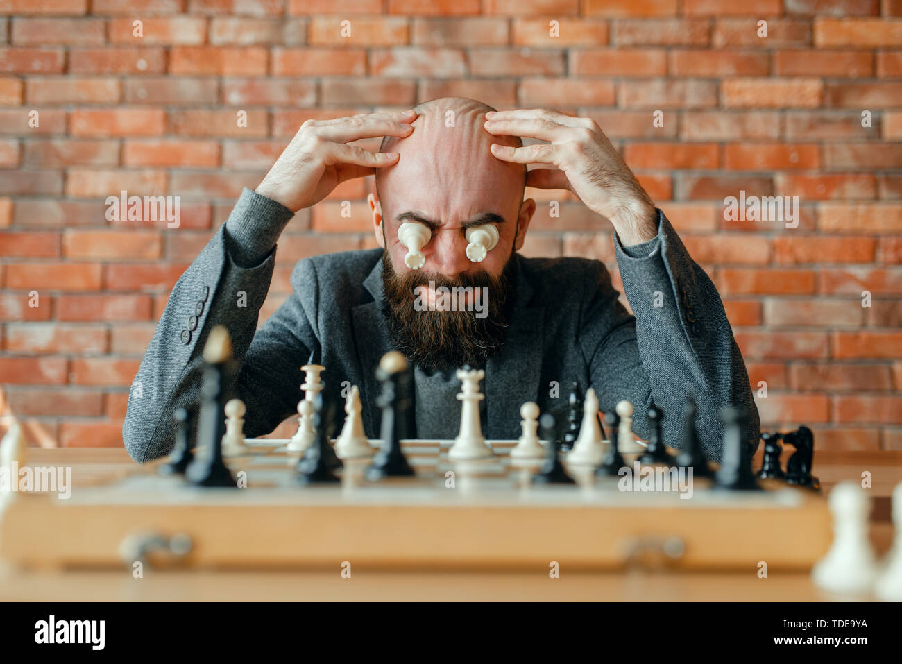 Male chess player with figures in the eyes Stock Photo - Alamy