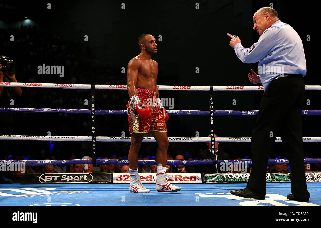 Kid Galahad gets a warning for holding by the referee during The IBF ...