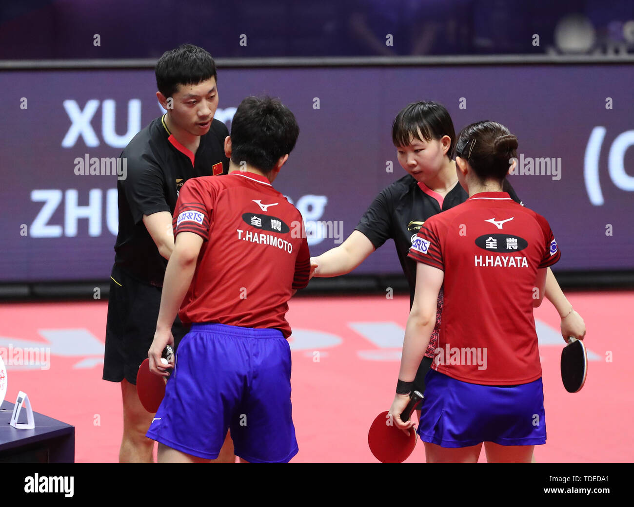 Sapporo, Japan. 15th June, 2019. Xu Xin (1st L) and Zhu Yuling (2nd R ...