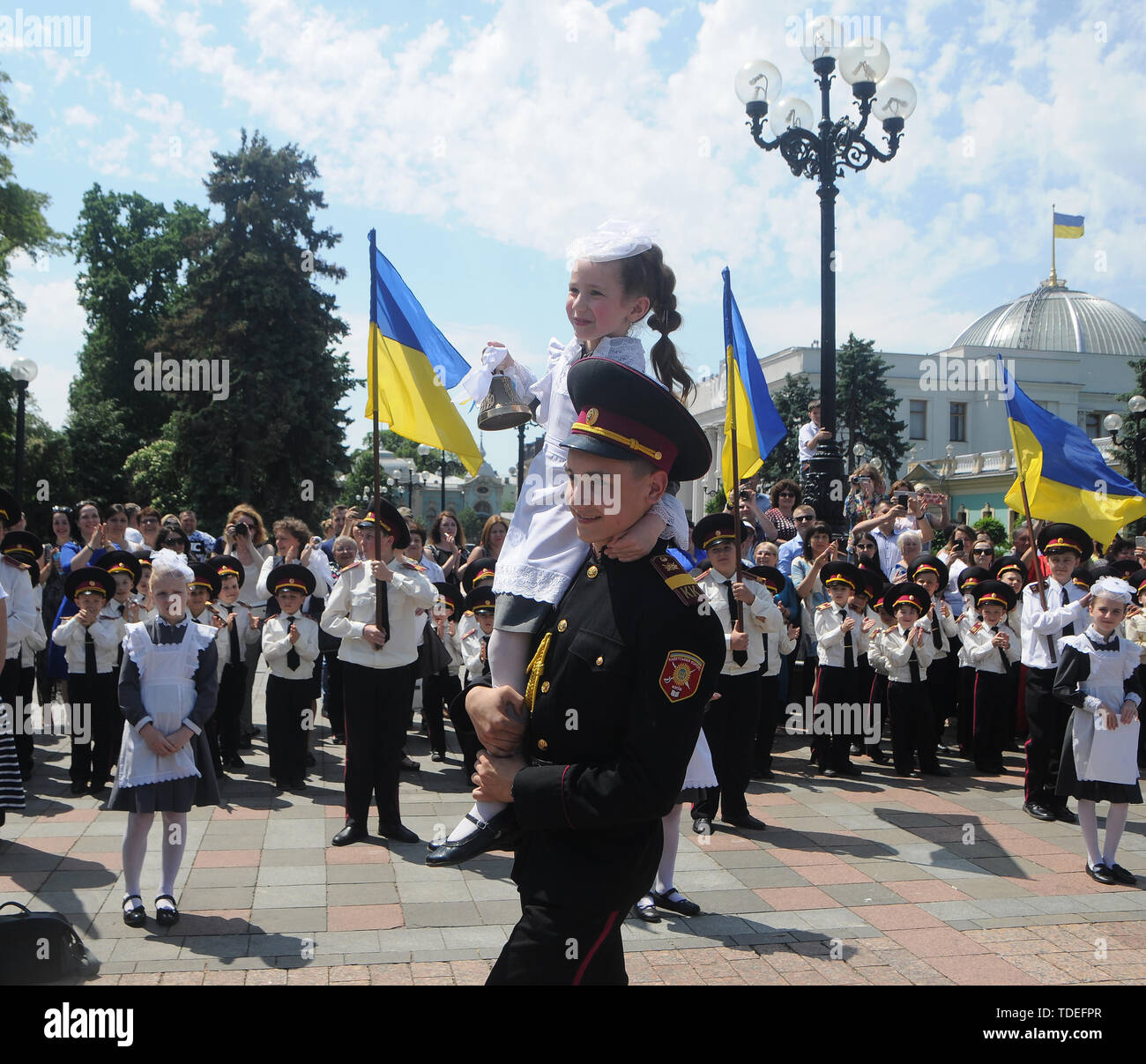 Kiev, Ukraine. 29th May, 2019. A cadet caries a pupil of an elementary ...