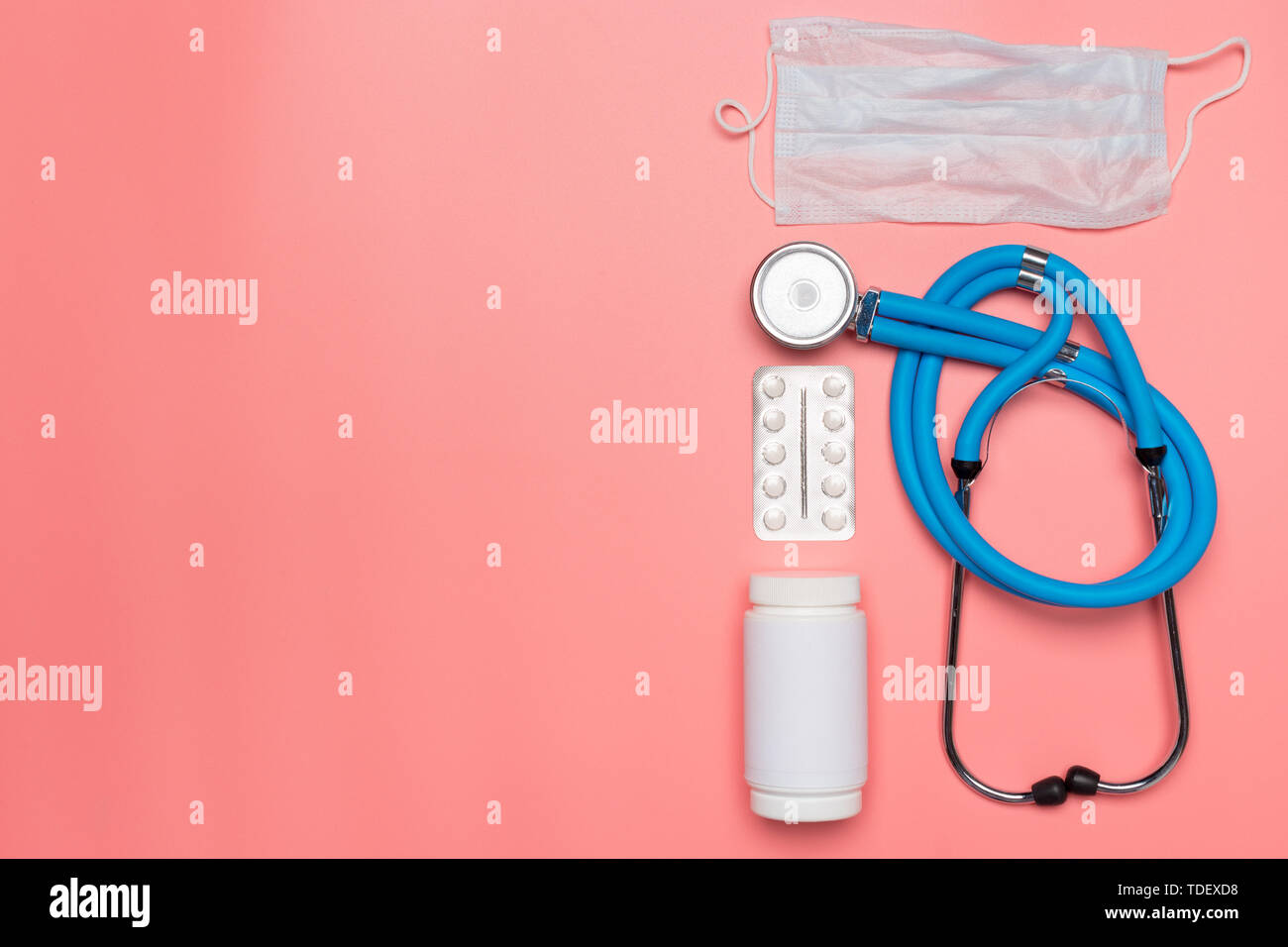 Medical equipment on a pink pastel background Stock Photo - Alamy