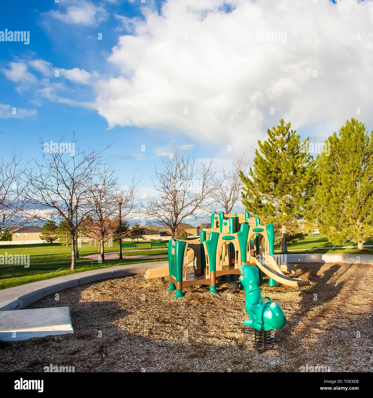 Square Playground in the middle of a circular pathway and vast field ...