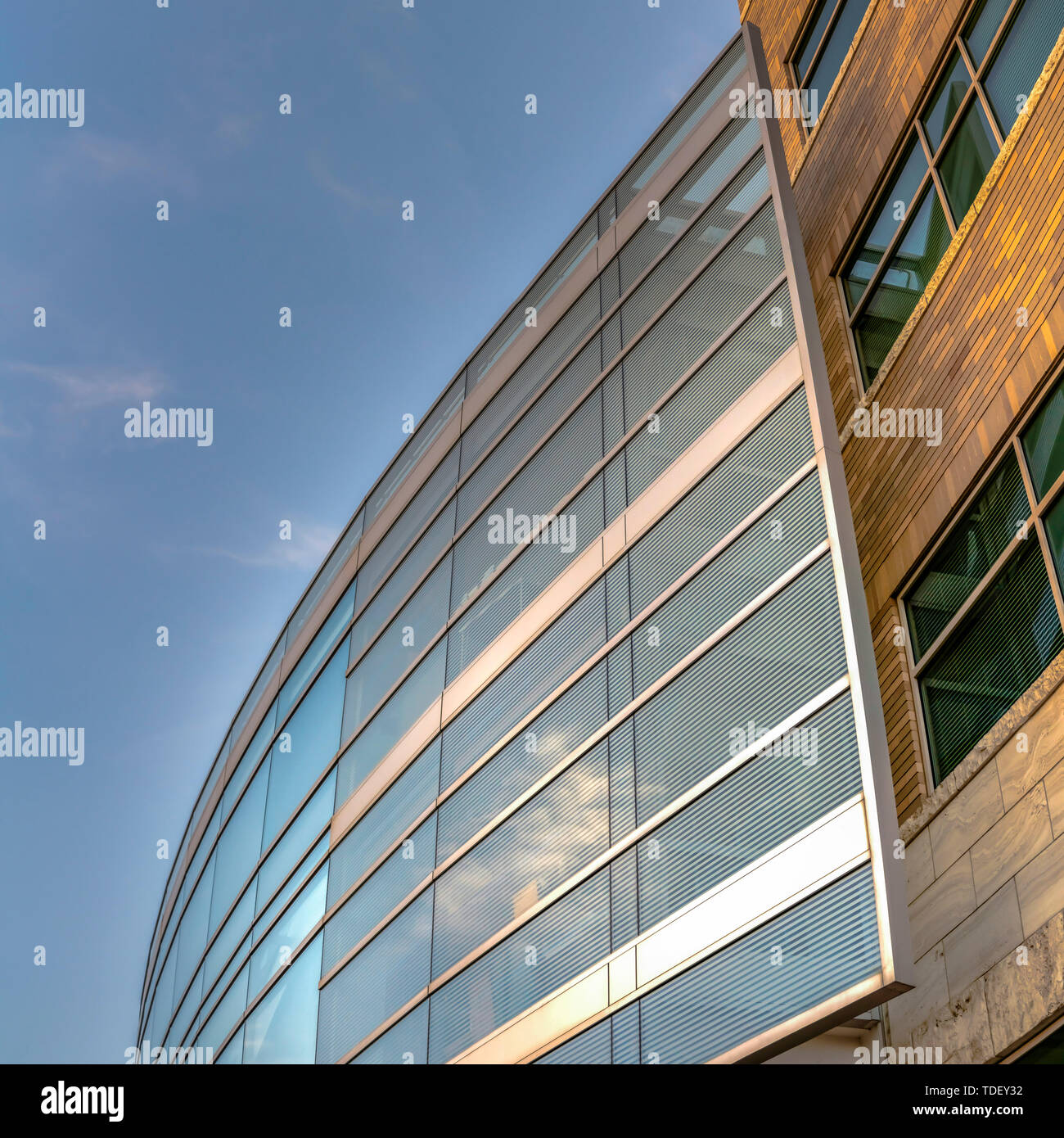Square frame Exterior of a modern building seen from below with blue ...