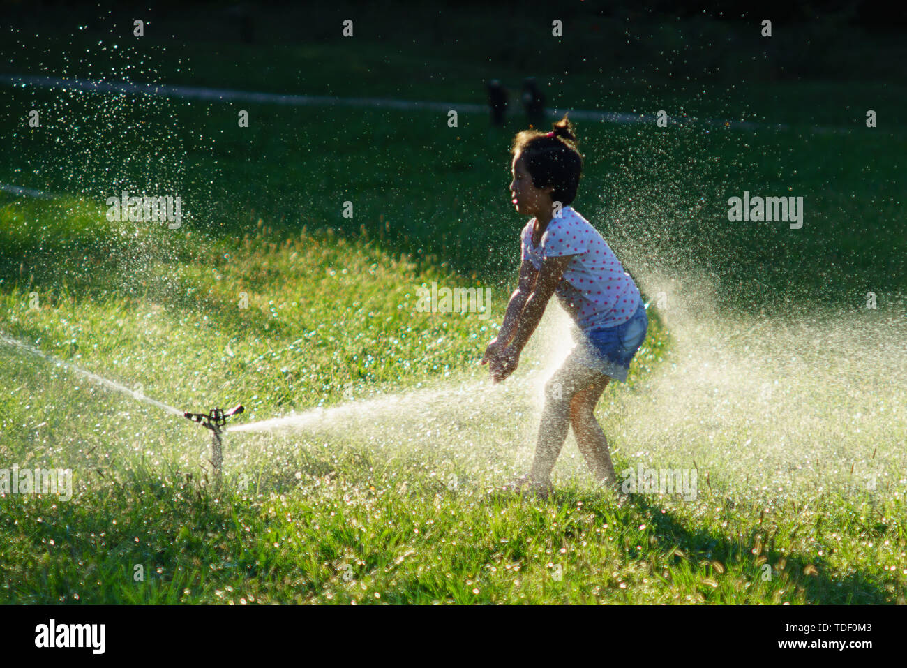 Playing water, children's fun Stock Photo - Alamy
