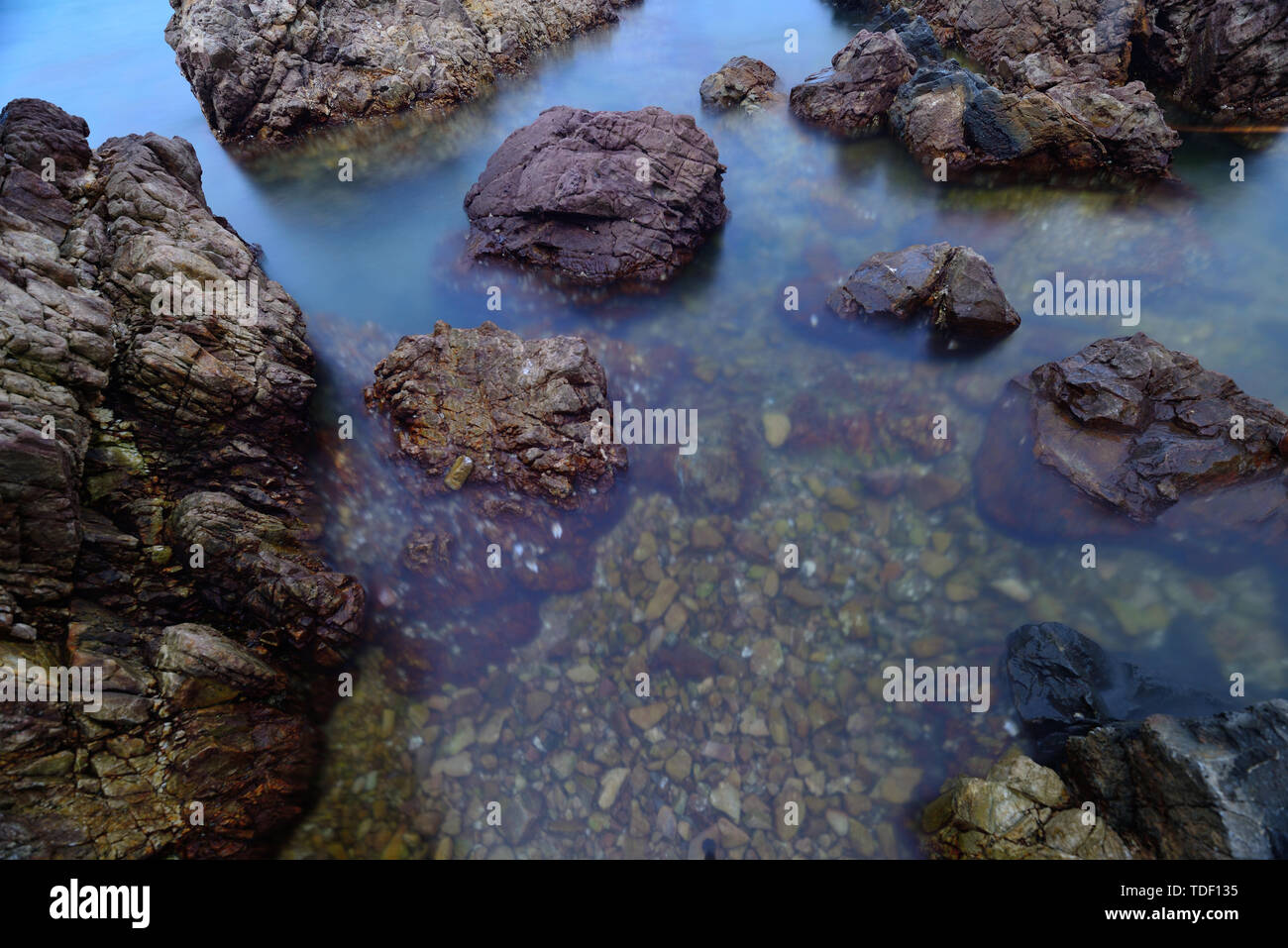 Slow shutter sea view rock natural scenery Stock Photo - Alamy