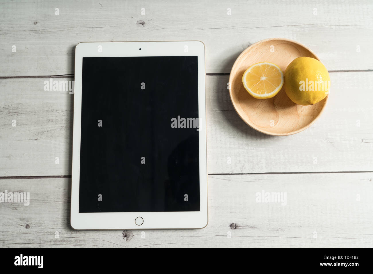 Lemon with tablet Stock Photo - Alamy