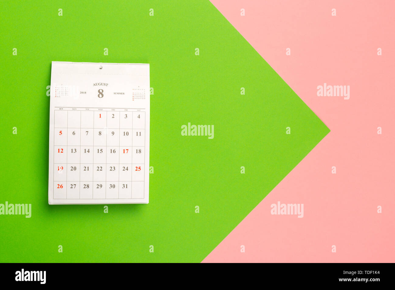 Calendar page on bright bicolor background, top view Stock Photo - Alamy