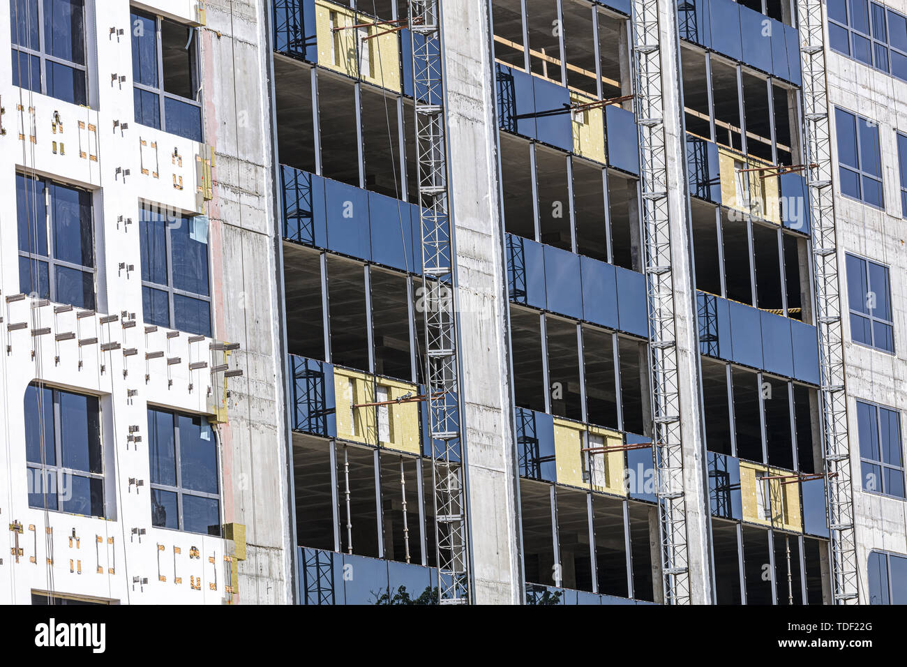 office building under construction. exterior insulation of building ...