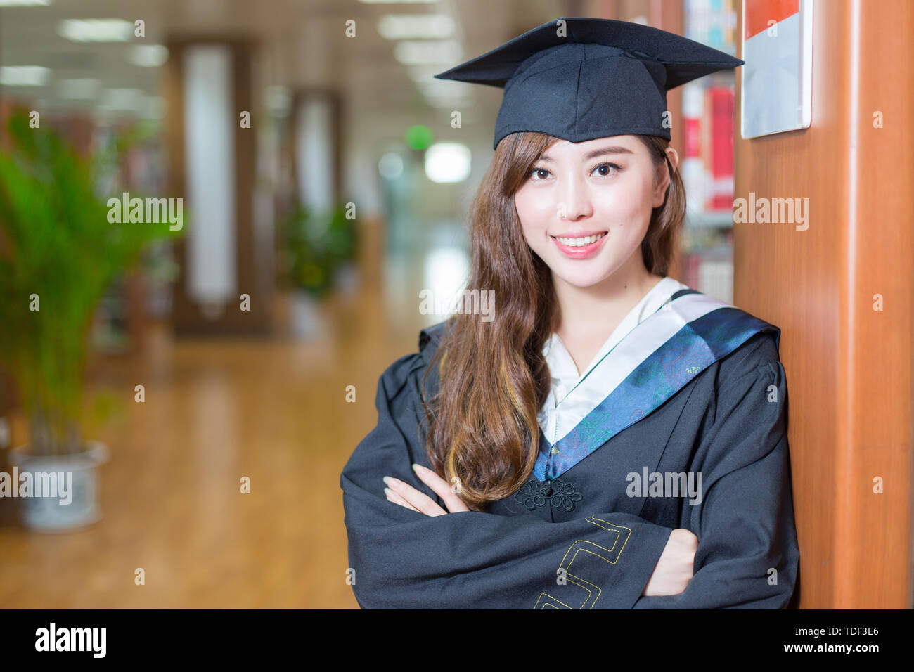 young beautiful asian girl university student with Bachelor gown in ...