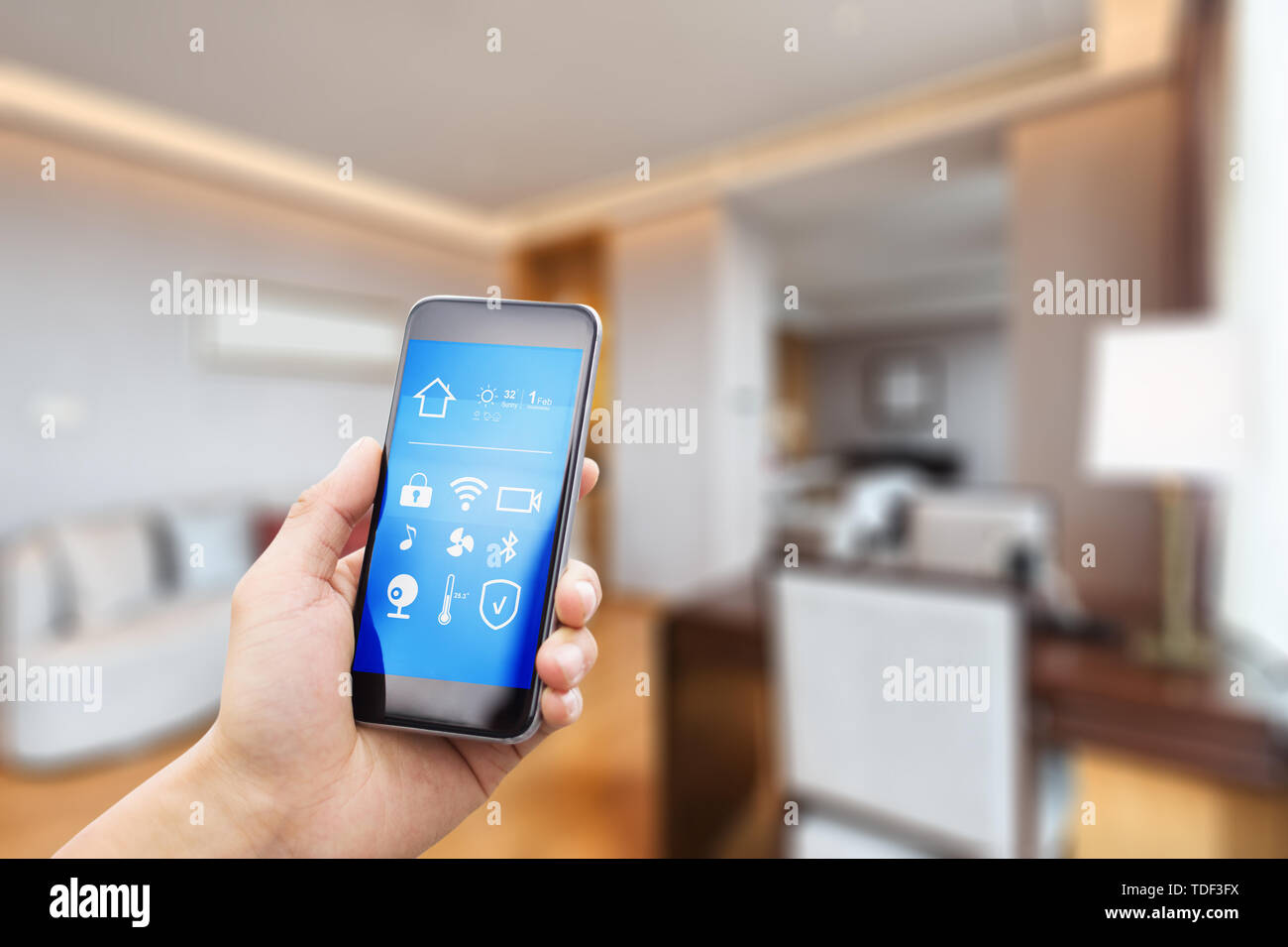 Mobile phone in smart home Stock Photo - Alamy