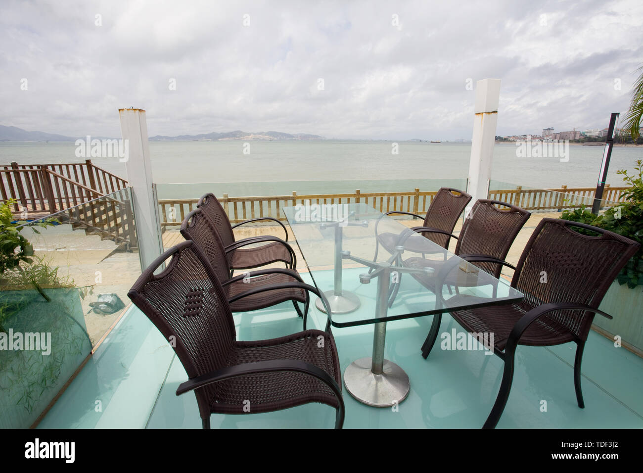Beach cafe with tables and chairs placed at the sea waterfront Stock ...