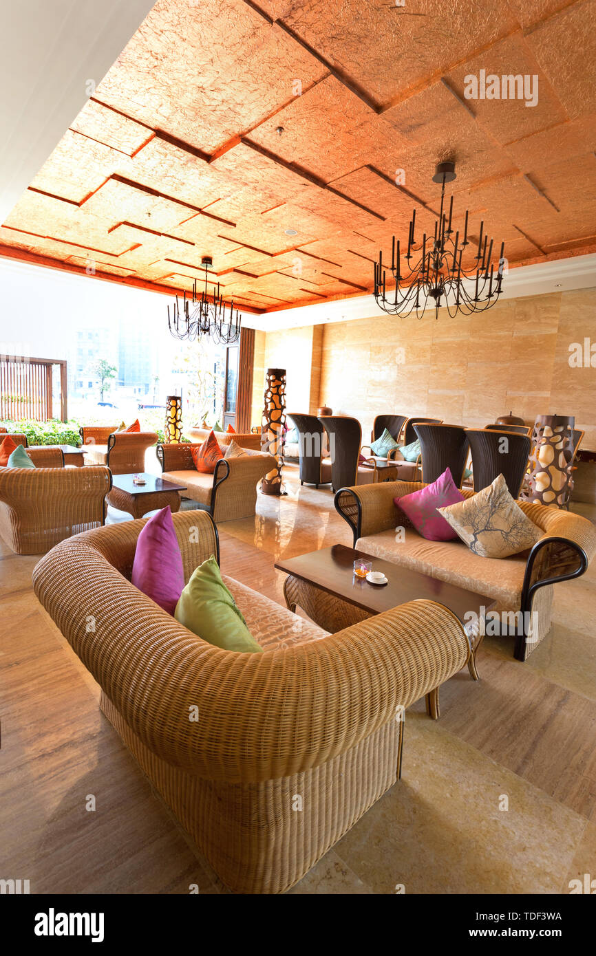 Room with tables and couches Stock Photo - Alamy