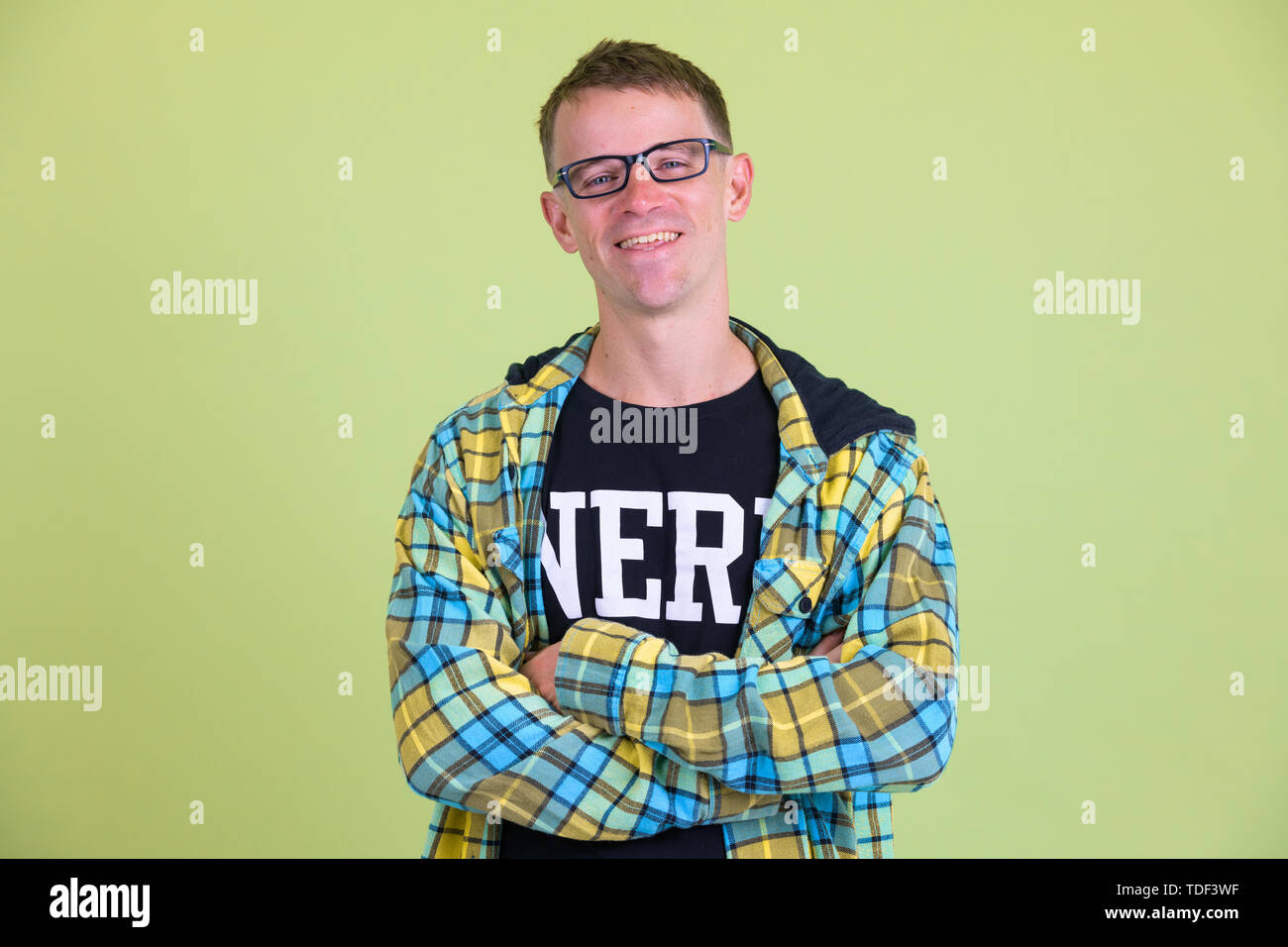 Portrait of happy nerd man smiling with arms crossed Stock Photo - Alamy