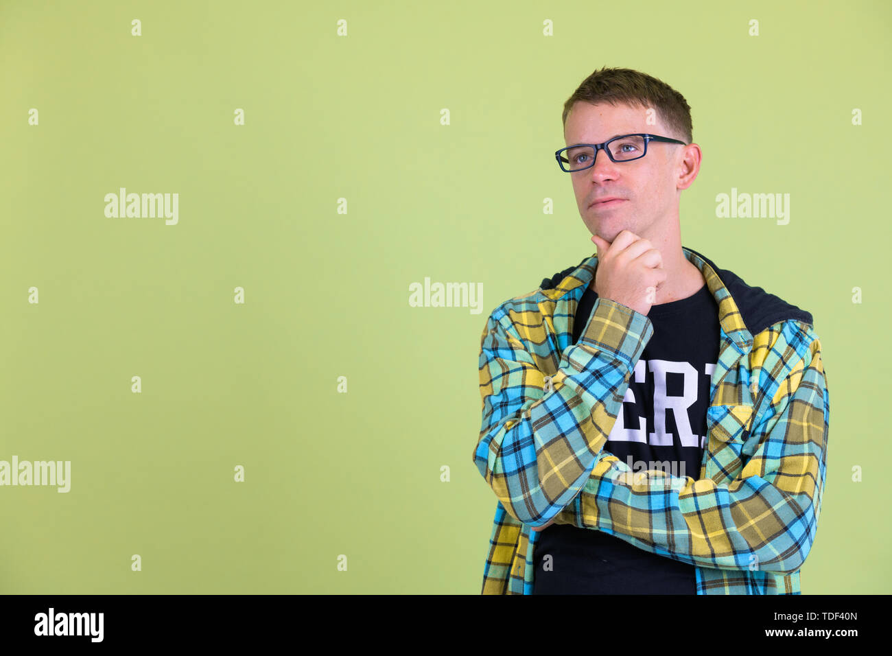 Portrait of nerd man with eyeglasses thinking and looking up Stock ...