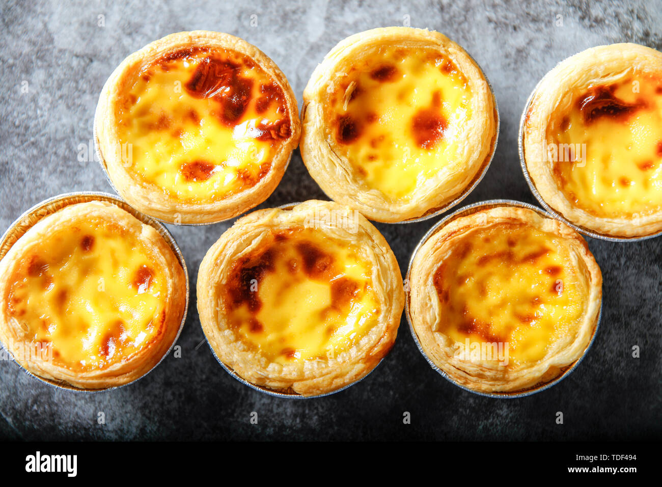 A golden delicacy West Point egg tart Stock Photo - Alamy