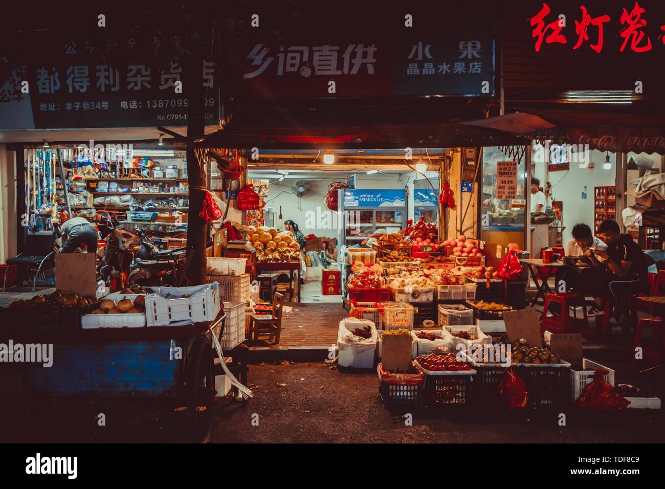At night, shops in the old town Stock Photo - Alamy