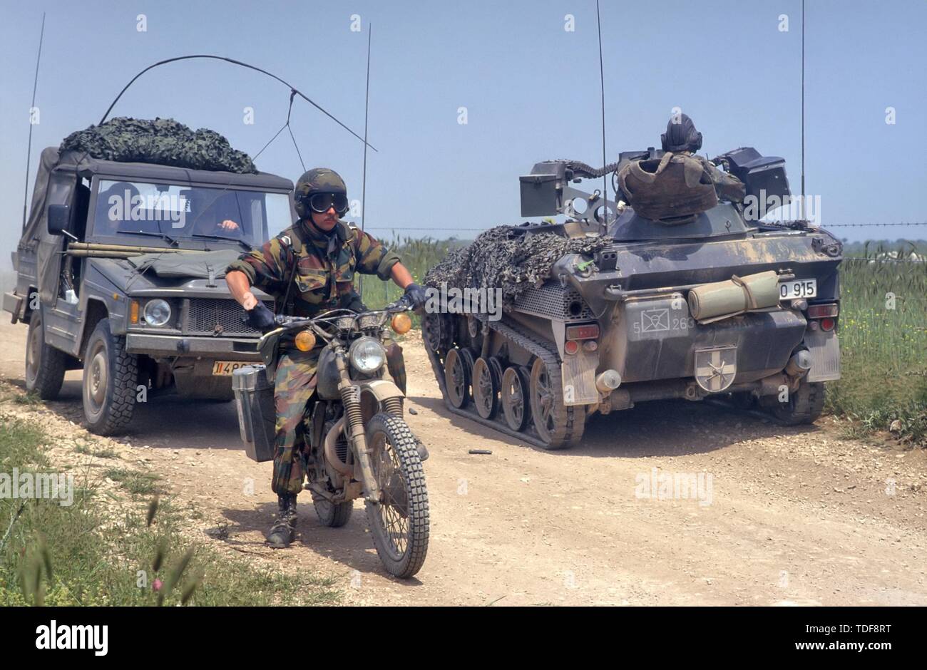 German paratroopers light tank Wiesel with a Belgian motorcyclist ...