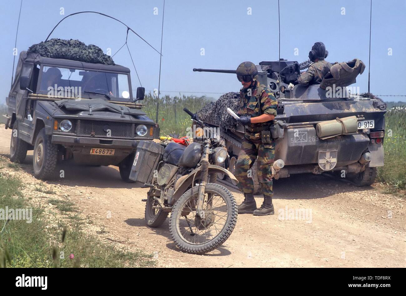 German paratroopers light tank Wiesel with a Belgian motorcyclist ...