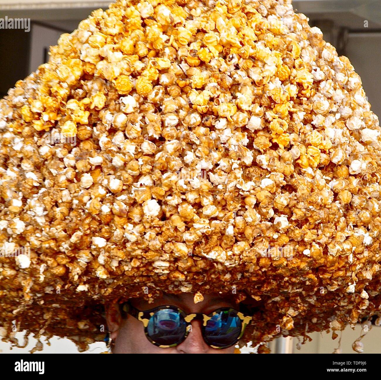 Man with a pop corn hat Stock Photo - Alamy