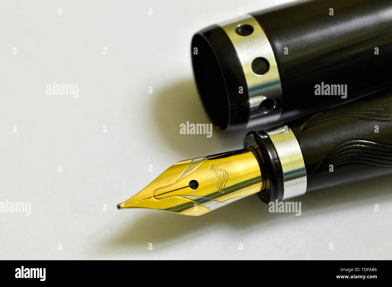 Tip of the fountain pen on white background Stock Photo - Alamy