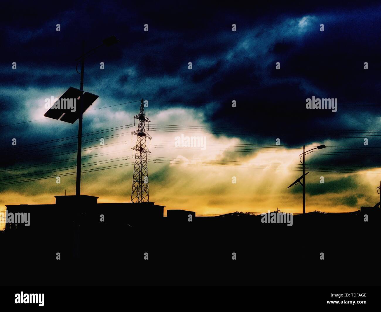 At sunset, there are dark clouds, and the sun can only penetrate ...