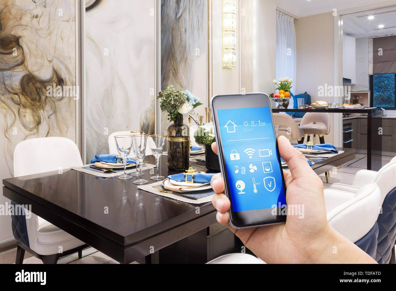 smart phone with smart home with modern dining room Stock Photo - Alamy