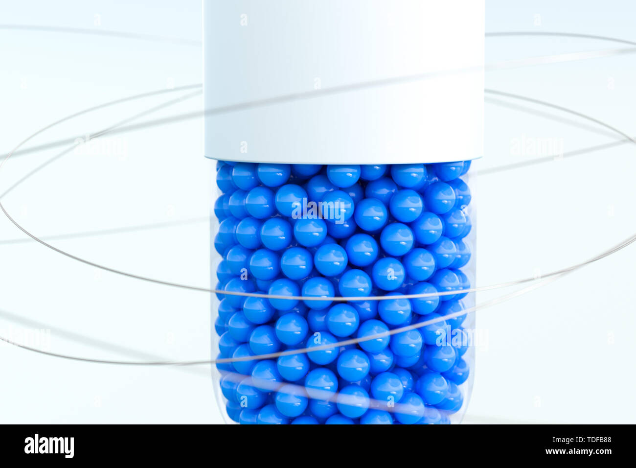 Blue granular capsule, 3-D rendering Stock Photo - Alamy
