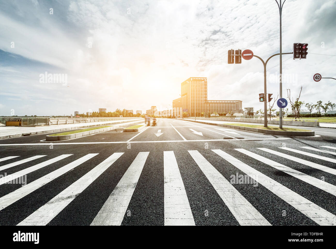 empty road with zebra crossing and direction board Stock Photo - Alamy