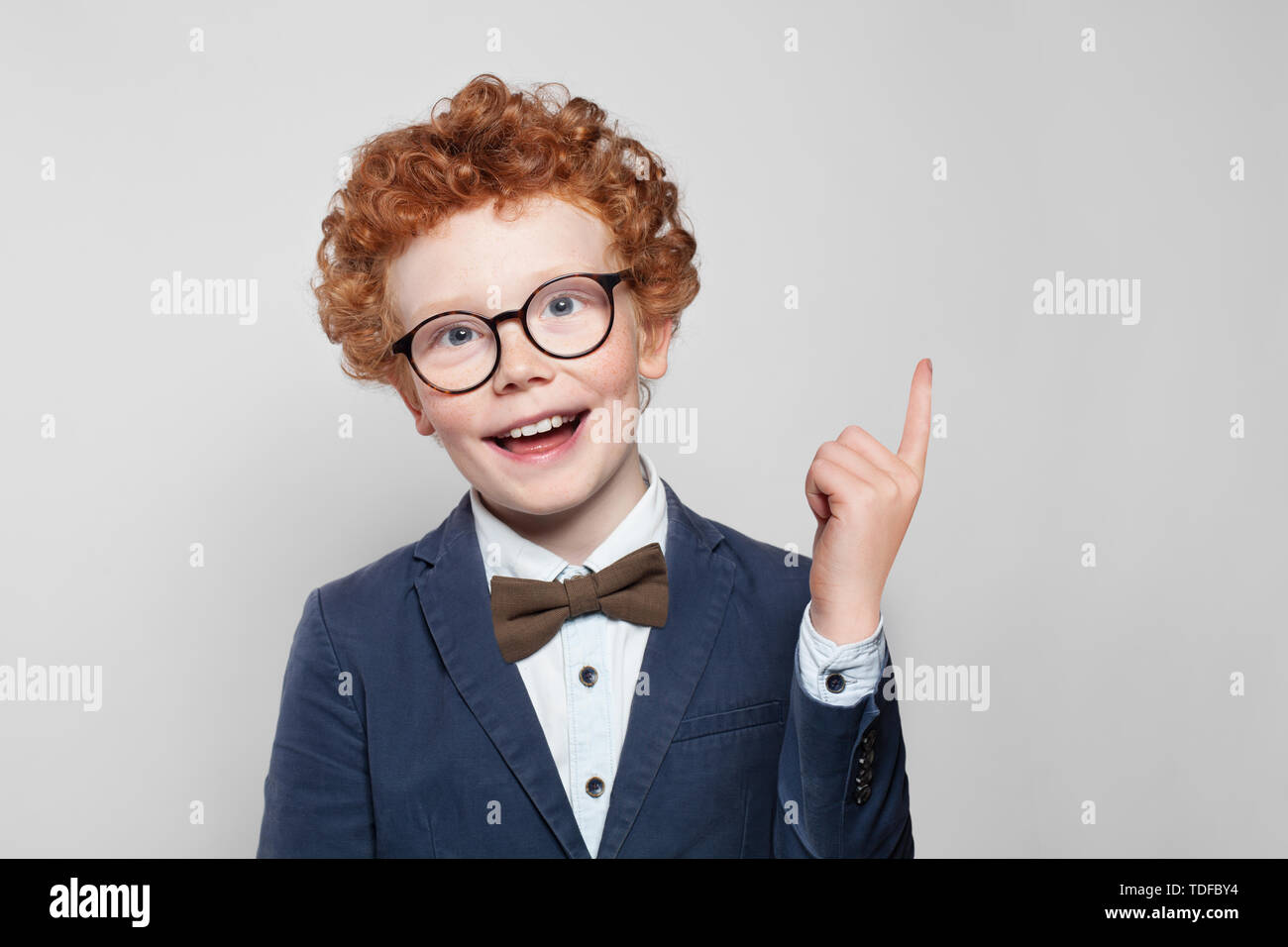 Funny child boy pointing up Stock Photo - Alamy