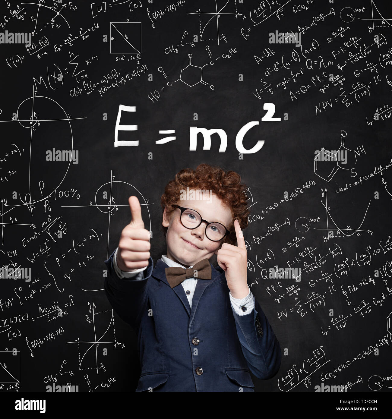 Happy school boy on science formulas background Stock Photo - Alamy