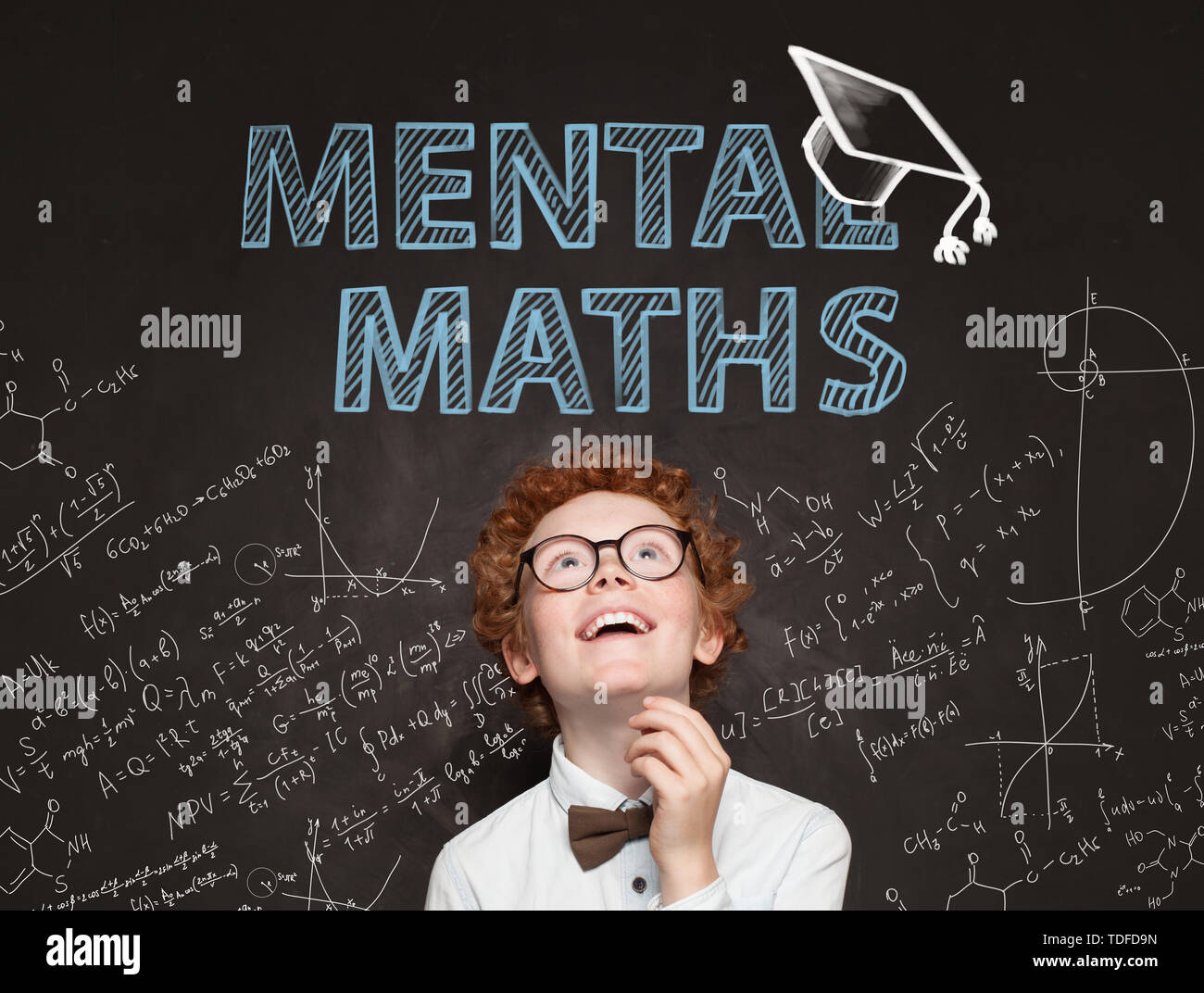 Cute child student having fun in classroom on chalkboard with maths ...