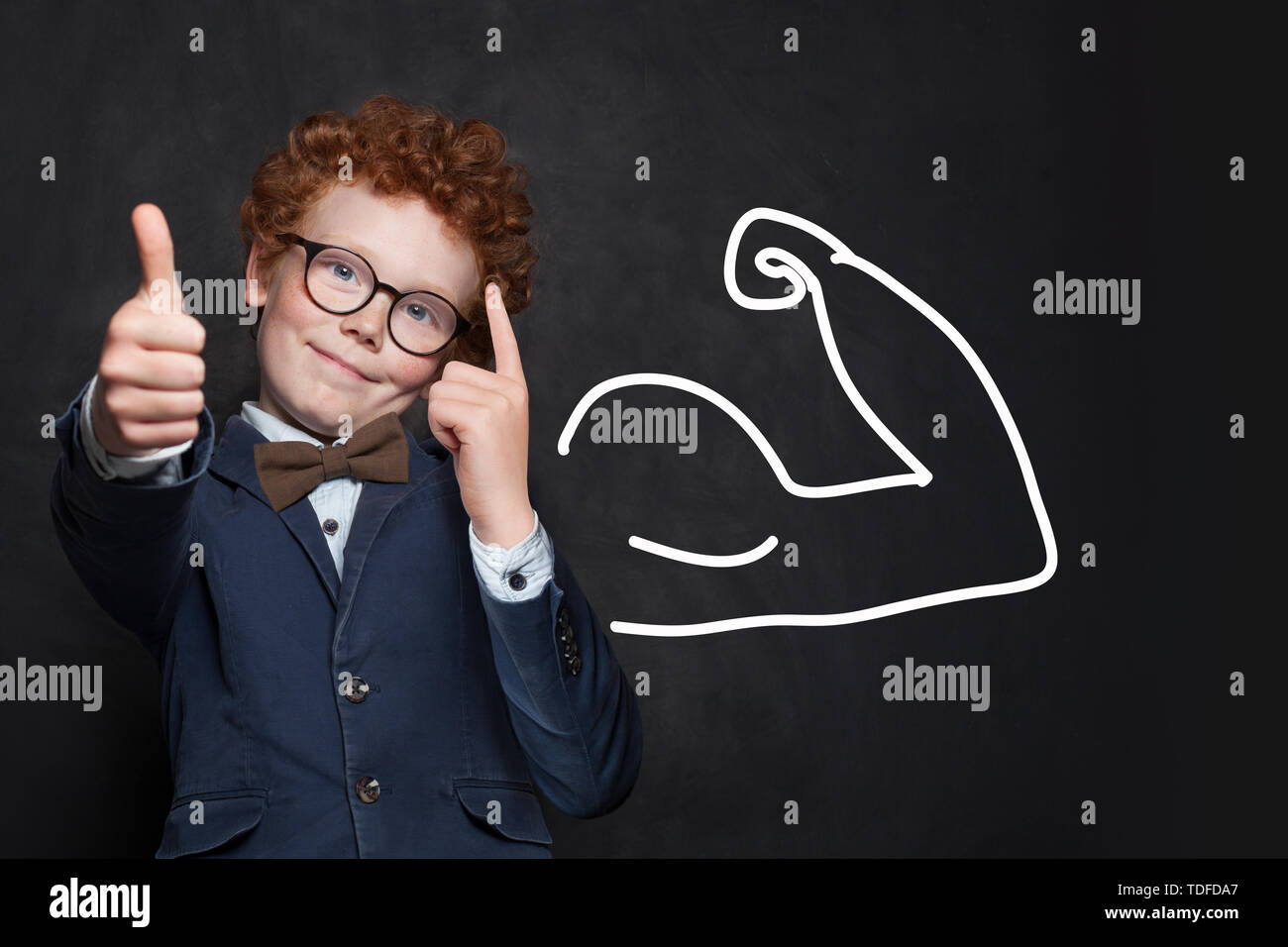 Smart child showing brain power. Brainstorming and idea concept Stock ...