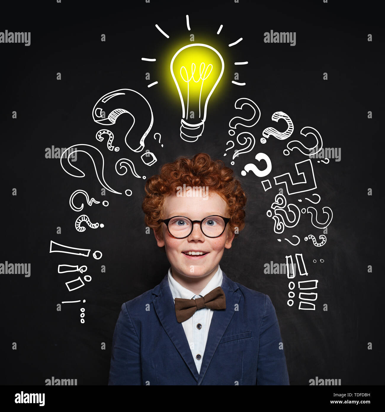 Idea! Smart kid student with lightbulb on blackboard Stock Photo - Alamy