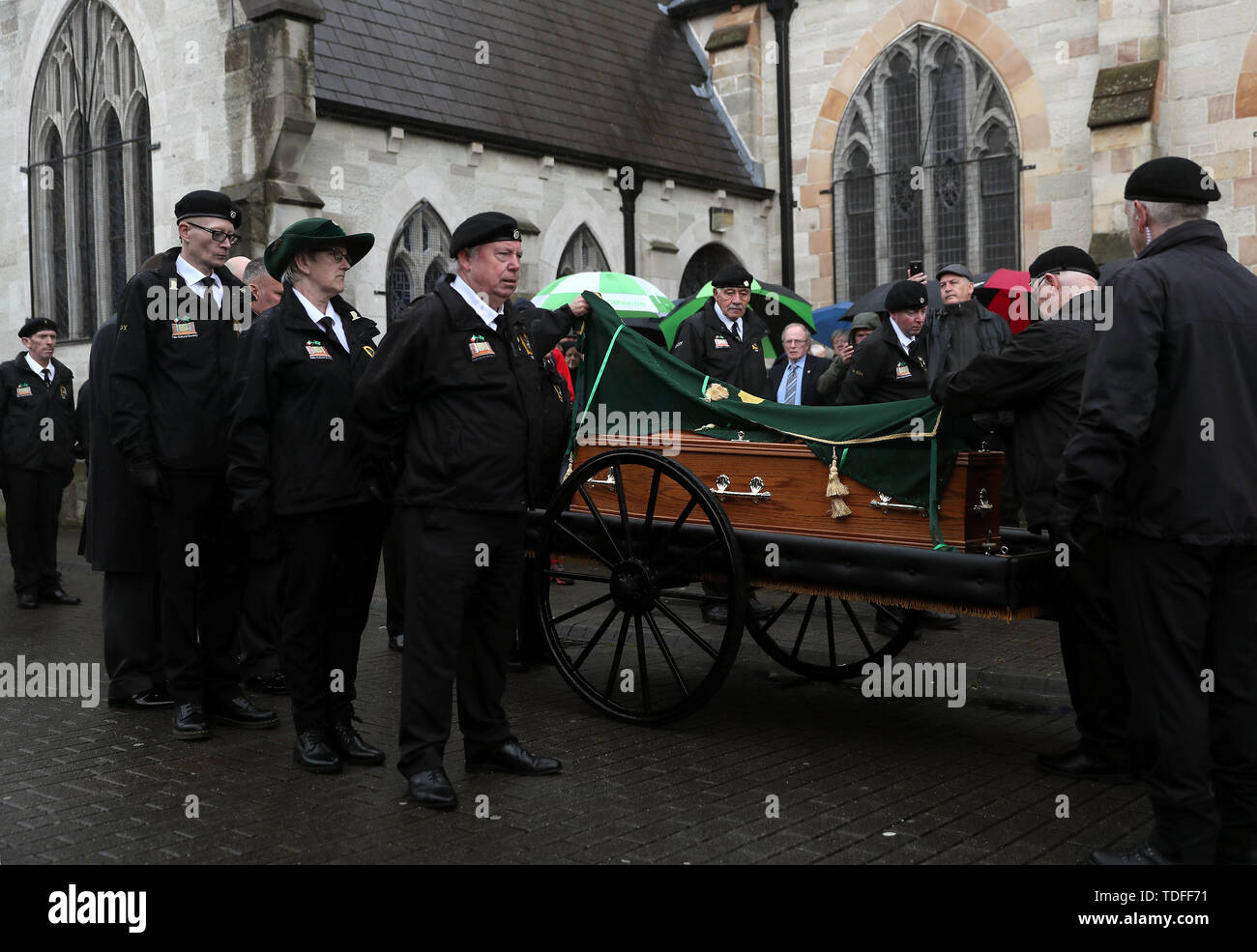 The coffin of former Provisional IRA leader Billy McKee is draped in a ...