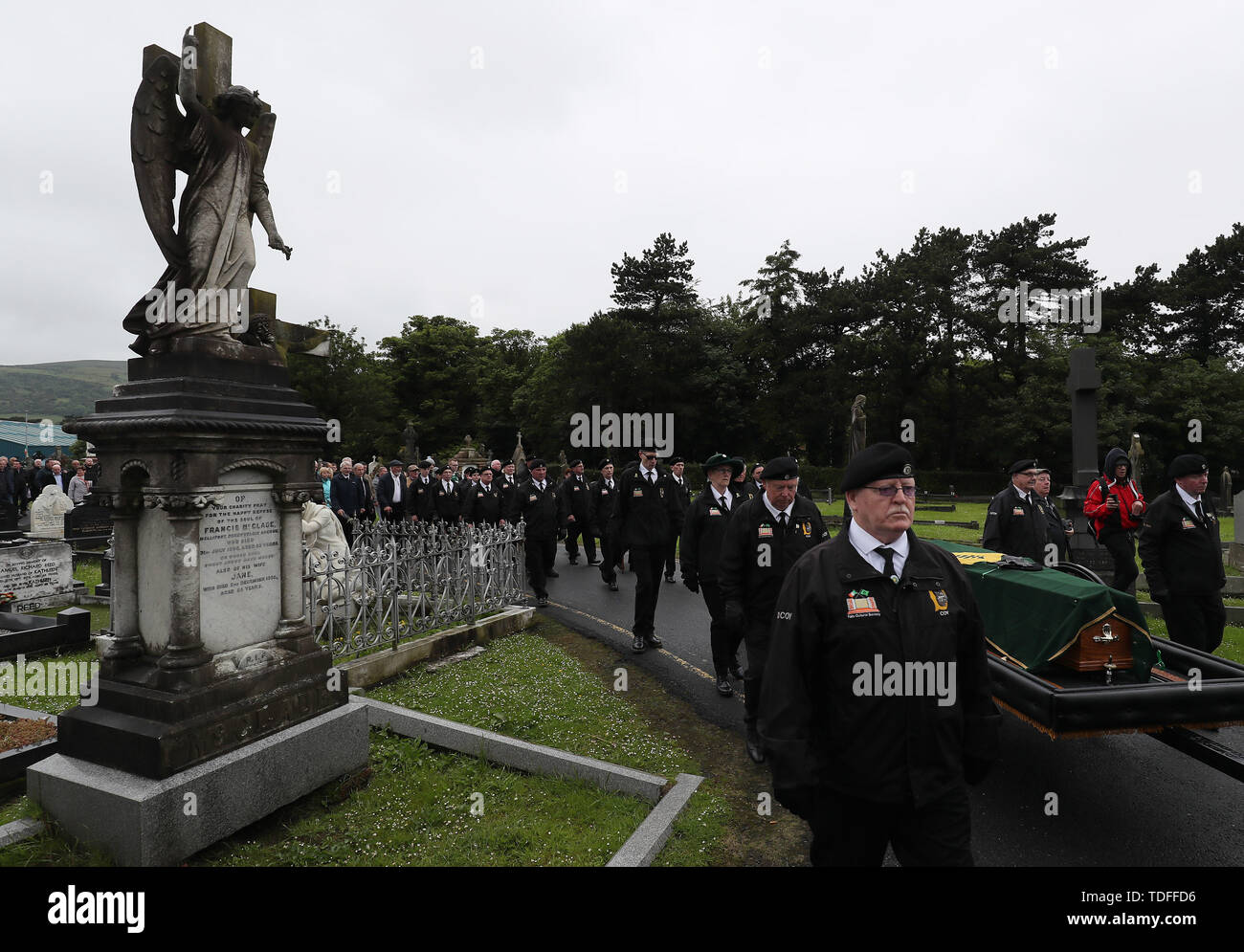 The coffin of former Provisional IRA leader Billy McKee is accompanied ...
