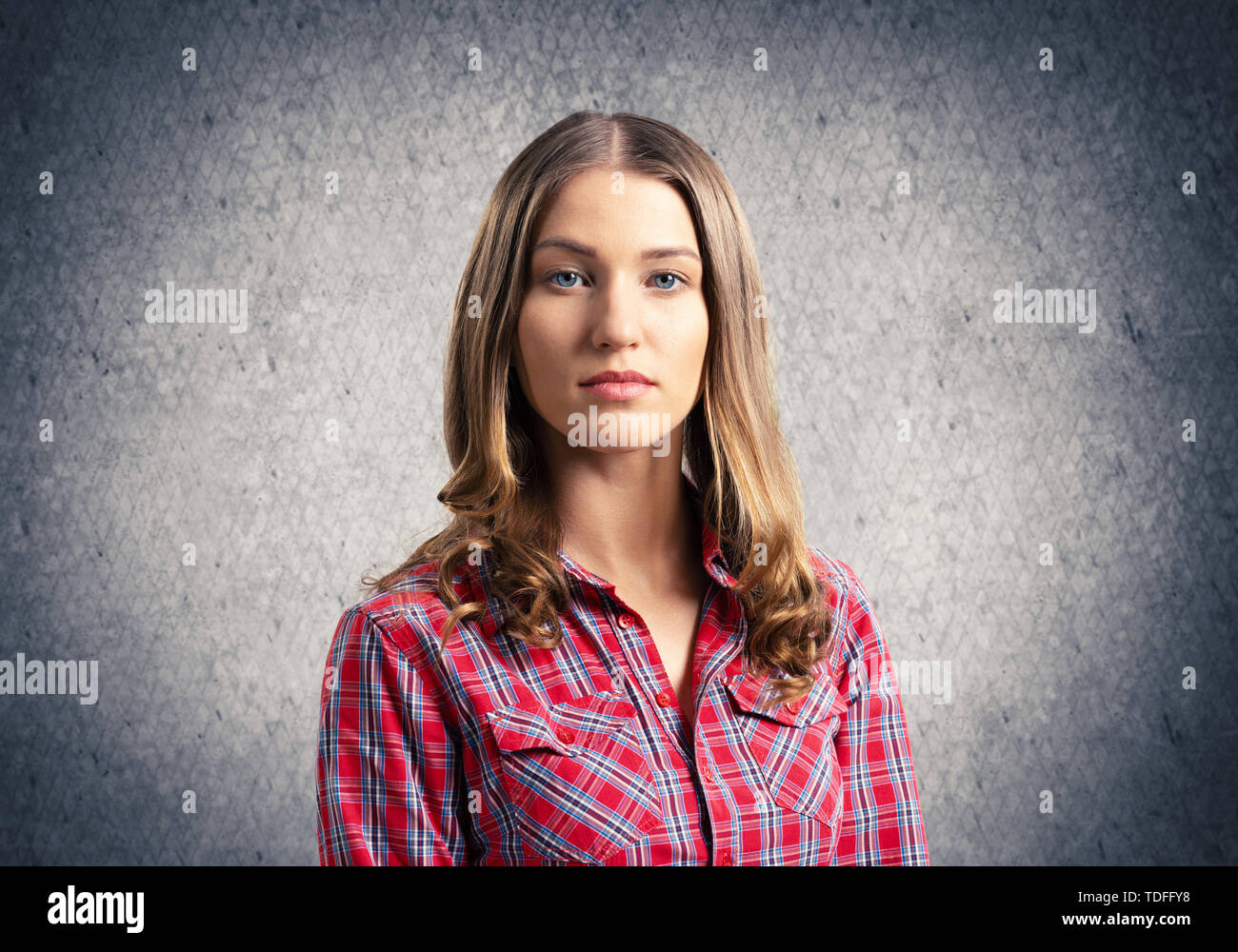 Young woman having serious and calm face. Caucasian female student has ...