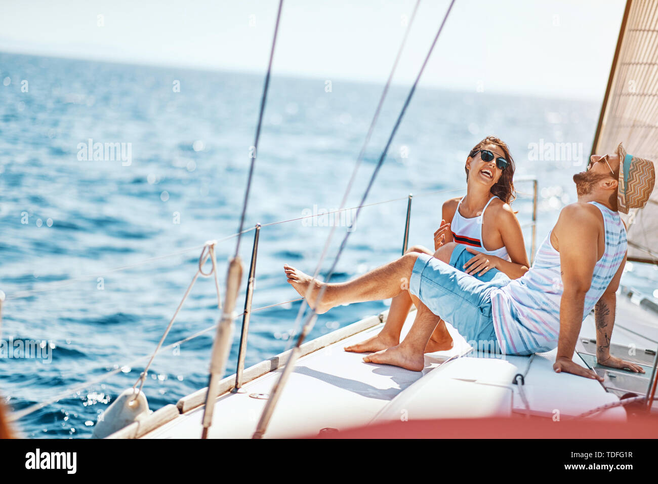 Couple relaxing together sailing boat hi-res stock photography and ...