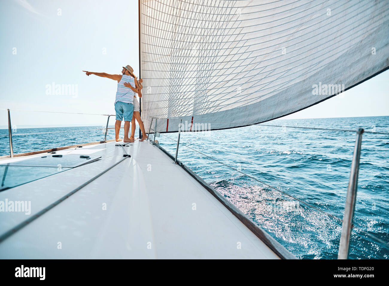 Young happy couple in love sailing sailboat yacht Stock Photo - Alamy