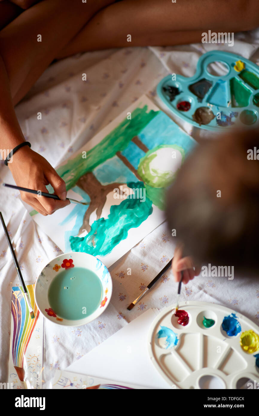 Person making artwork painting with watercolors Stock Photo - Alamy