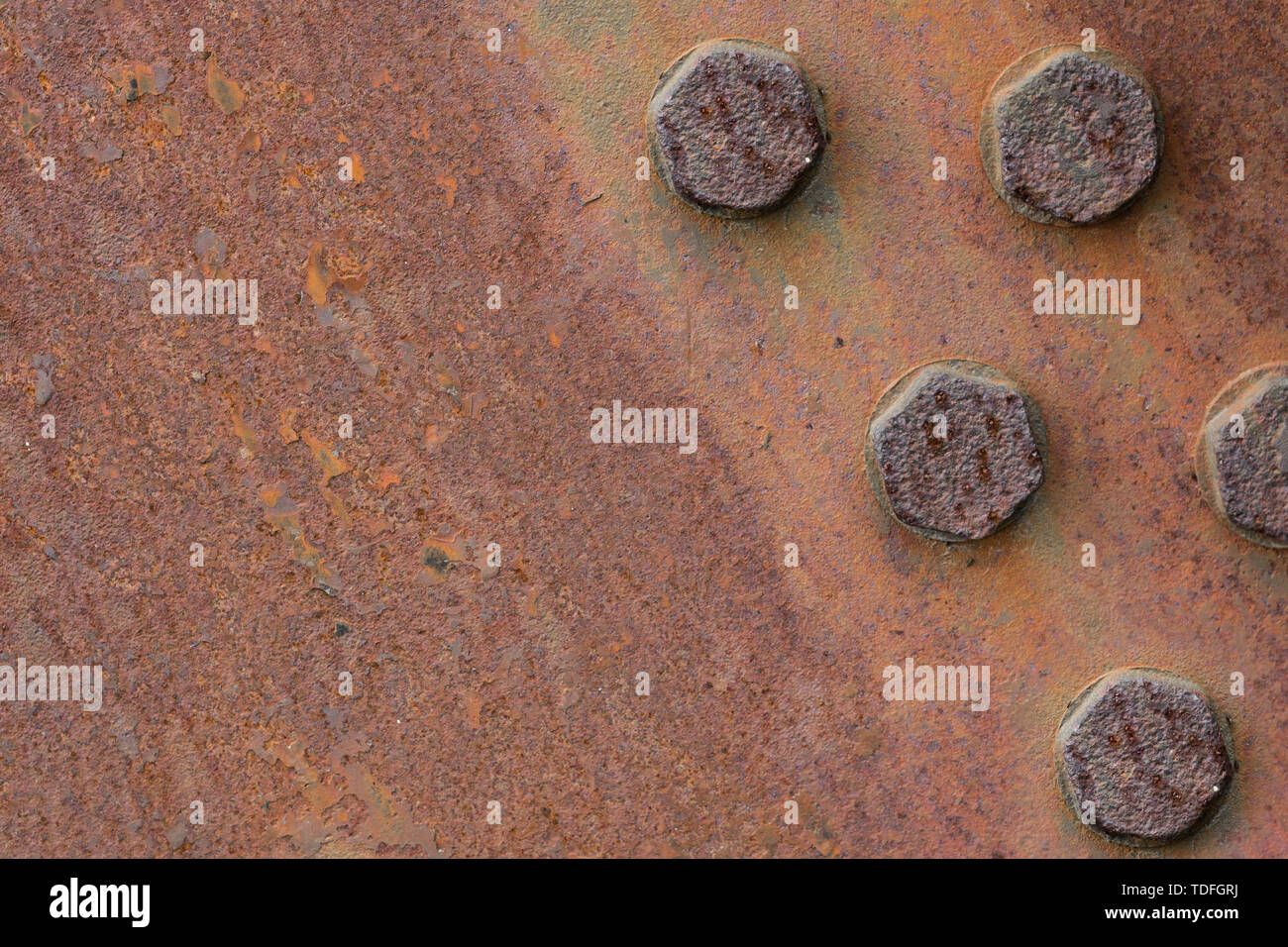 Rusty metal plate texture with bolts. Copy space Stock Photo - Alamy