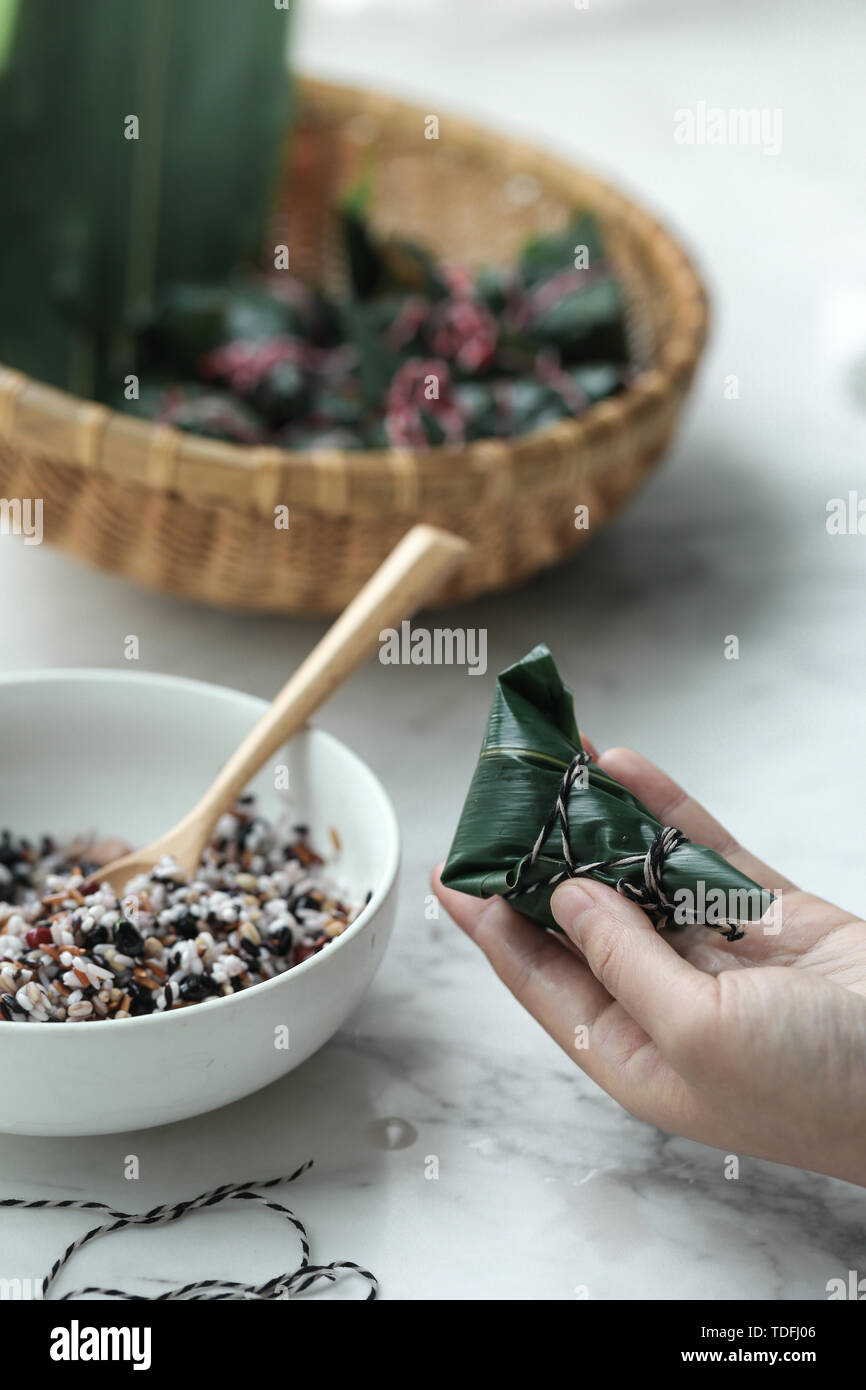 Handmade triangular dumplings Stock Photo - Alamy